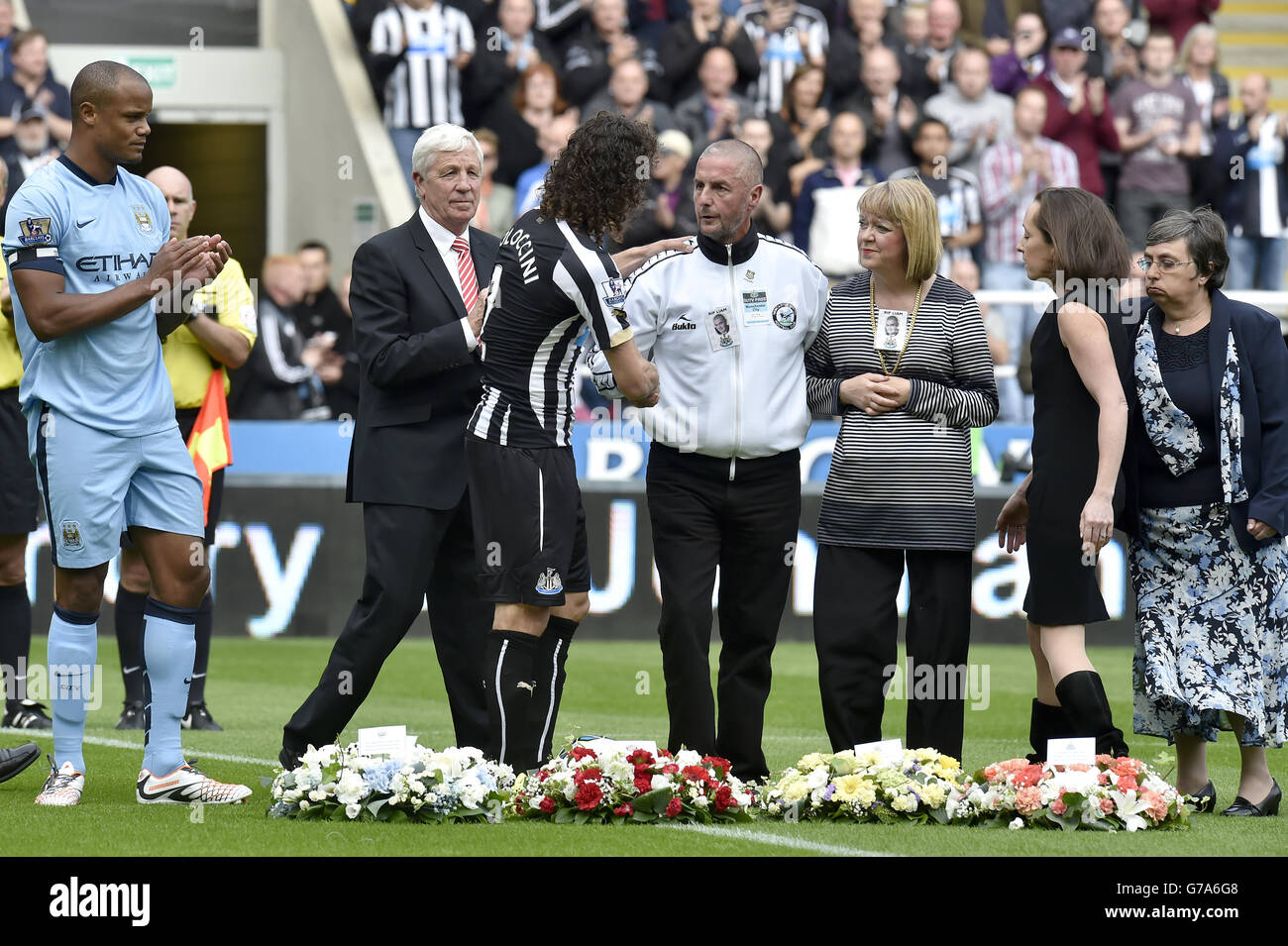 Newcastle United captain Fabrizio Coloccini (centre left) greets Barry ...