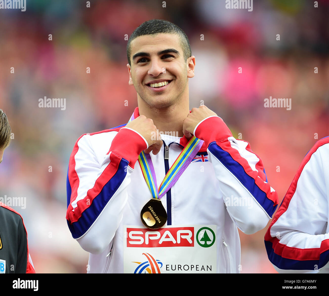 Great Britain's Adam Gemili stands on the podium with his gold medal he ...