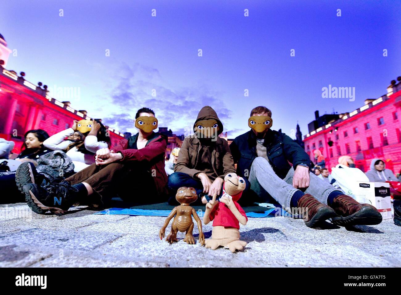 Film fans wearing E.T masks celebrate the 10th anniversary of the Film4 ...