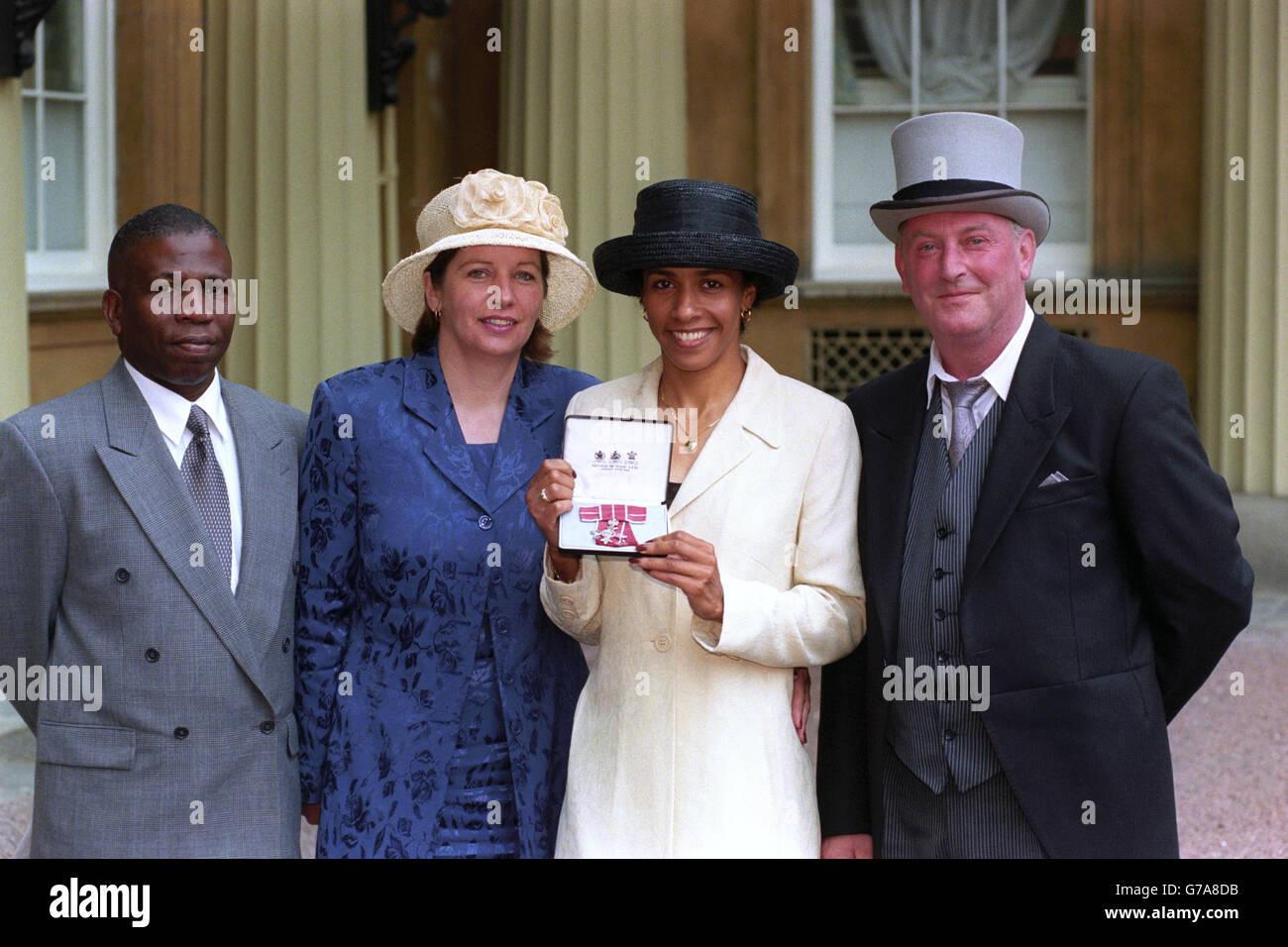 Athlete Kelly Holmes at Buckingham Palace with her father Derrick ...