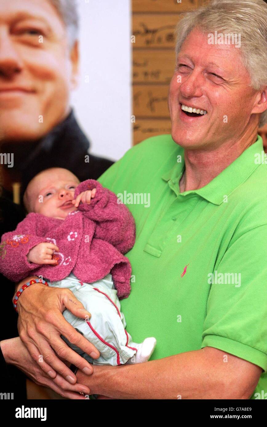 Former US President Bill Clinton holds seven-month-old Chiara ...