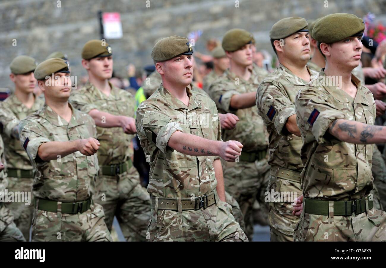 Soldiers from the 1st Battalion Coldstream Guards make their way past ...