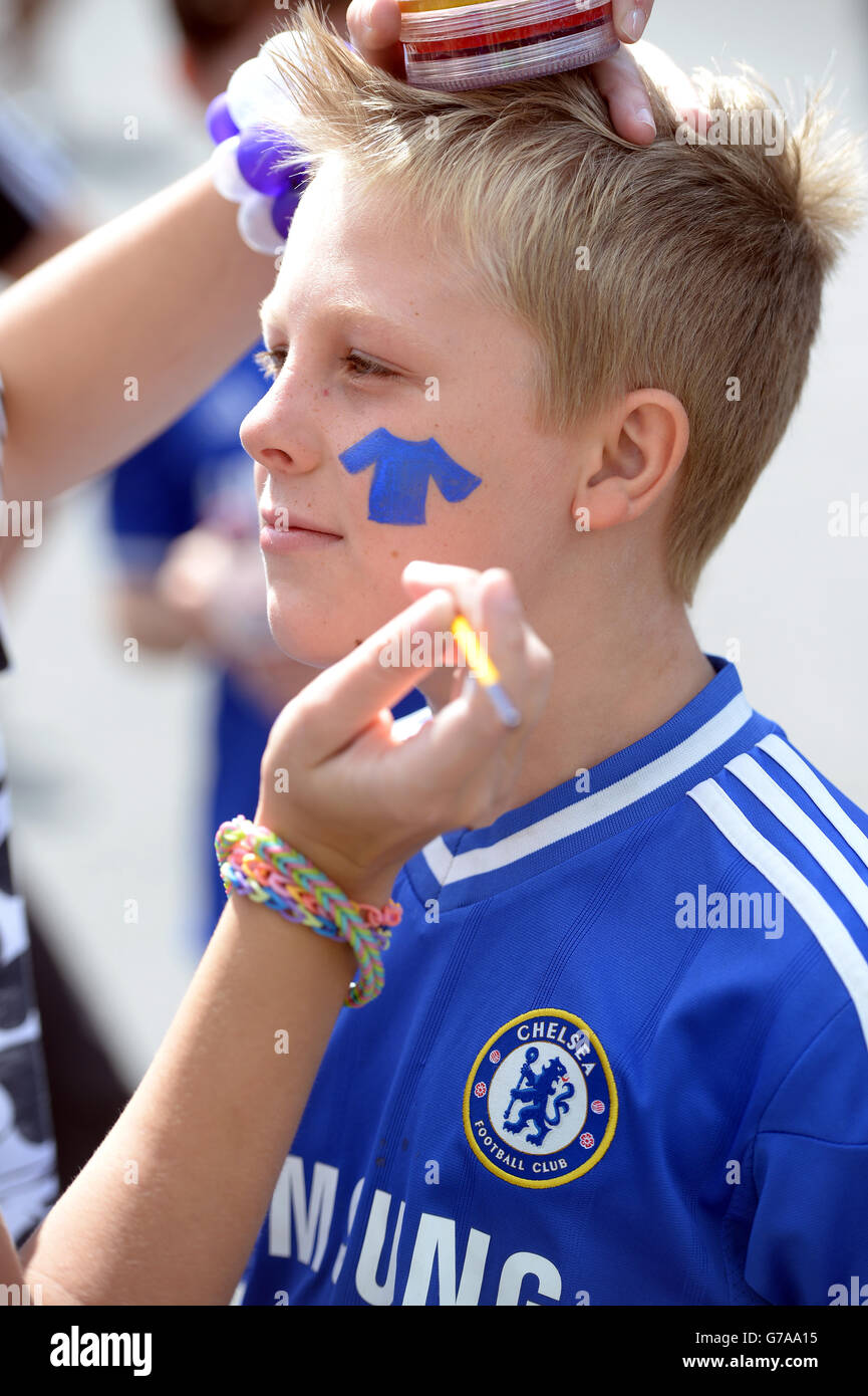 Face painting outside the ground before the Barclays Premier League ...