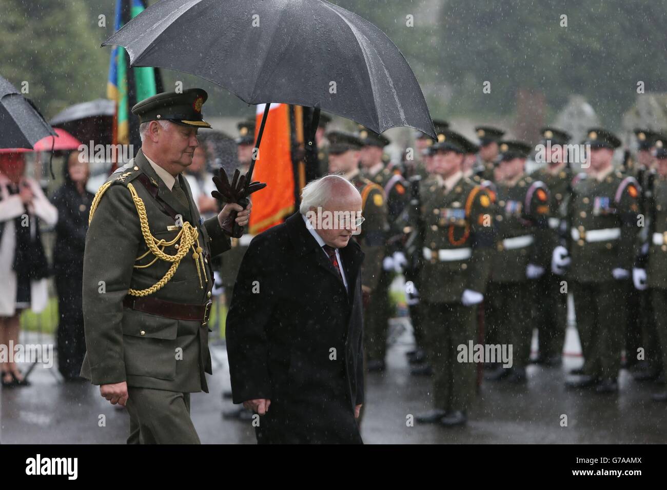 Irish President Michael D Higgins follows the coffin of former ...
