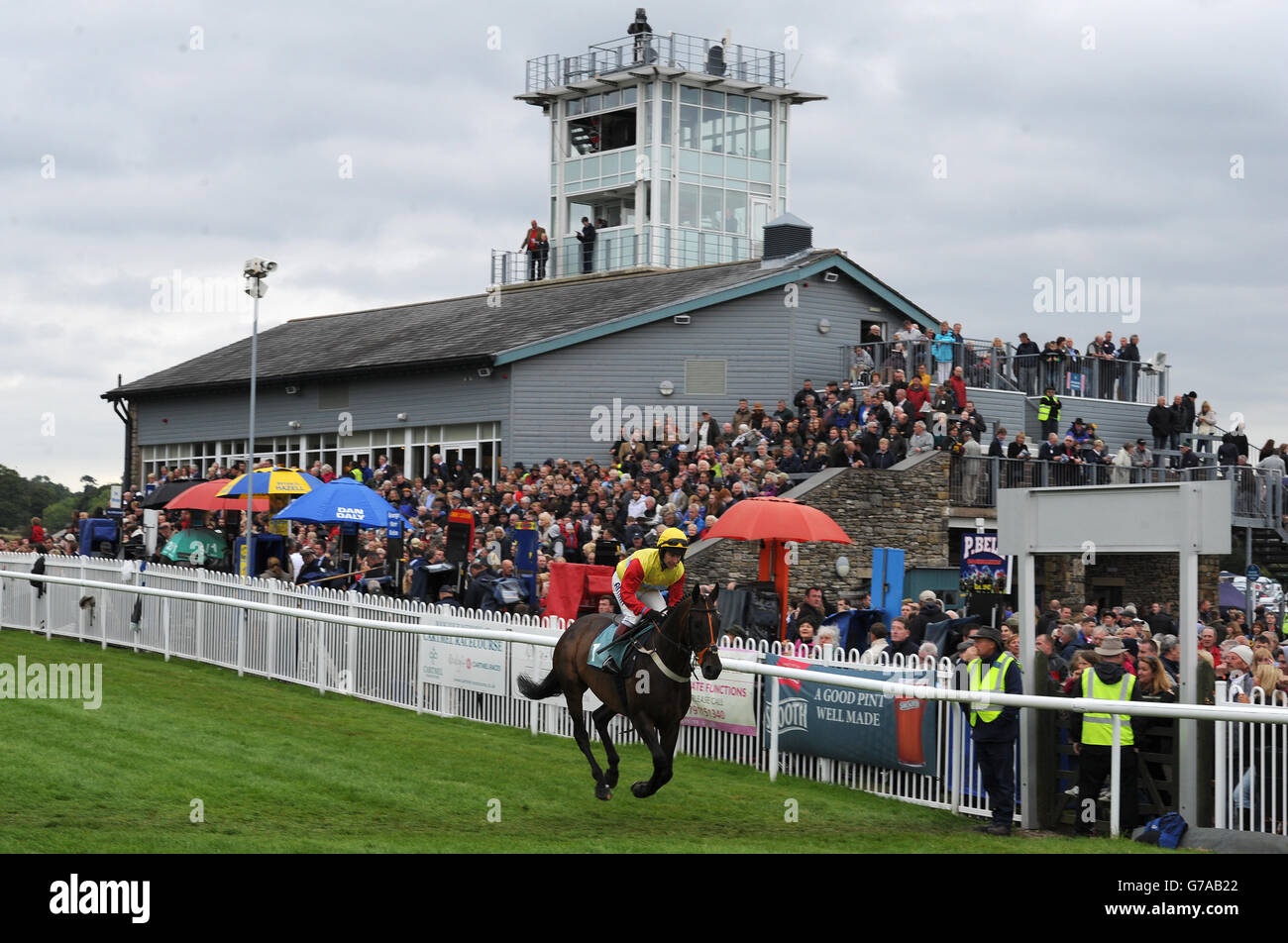 A horse is ridden to post at Cartmel Racecourse, Cartmel, Cumbria Stock ...