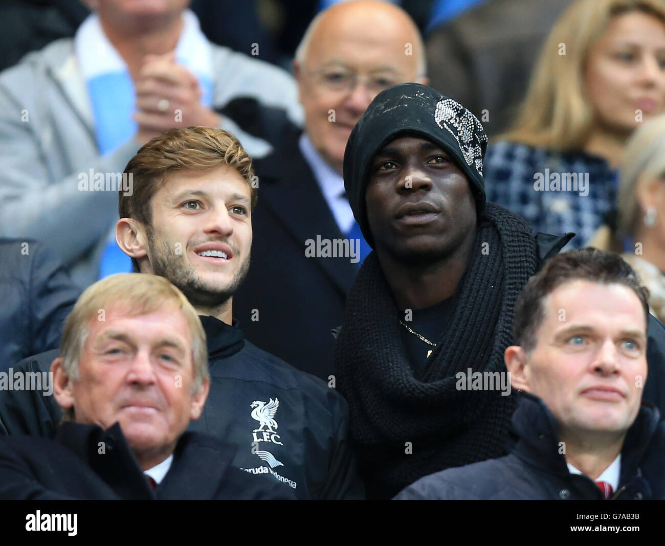 Liverpool's Adam Lallana (left) and Mario Balotelli in the stands ...