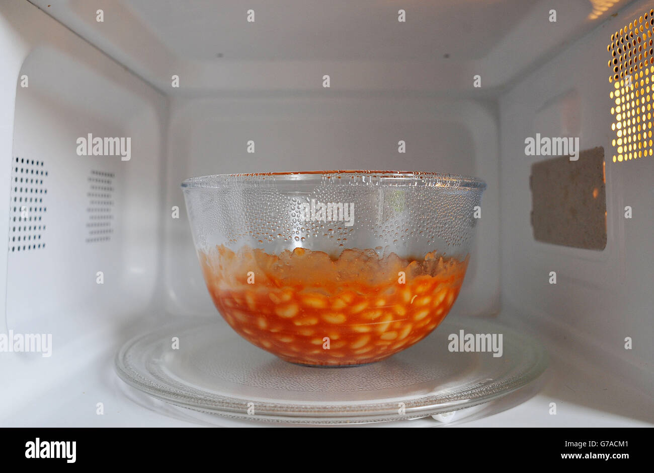 A bowl baked beans in a microwave cooker hi-res stock photography and ...