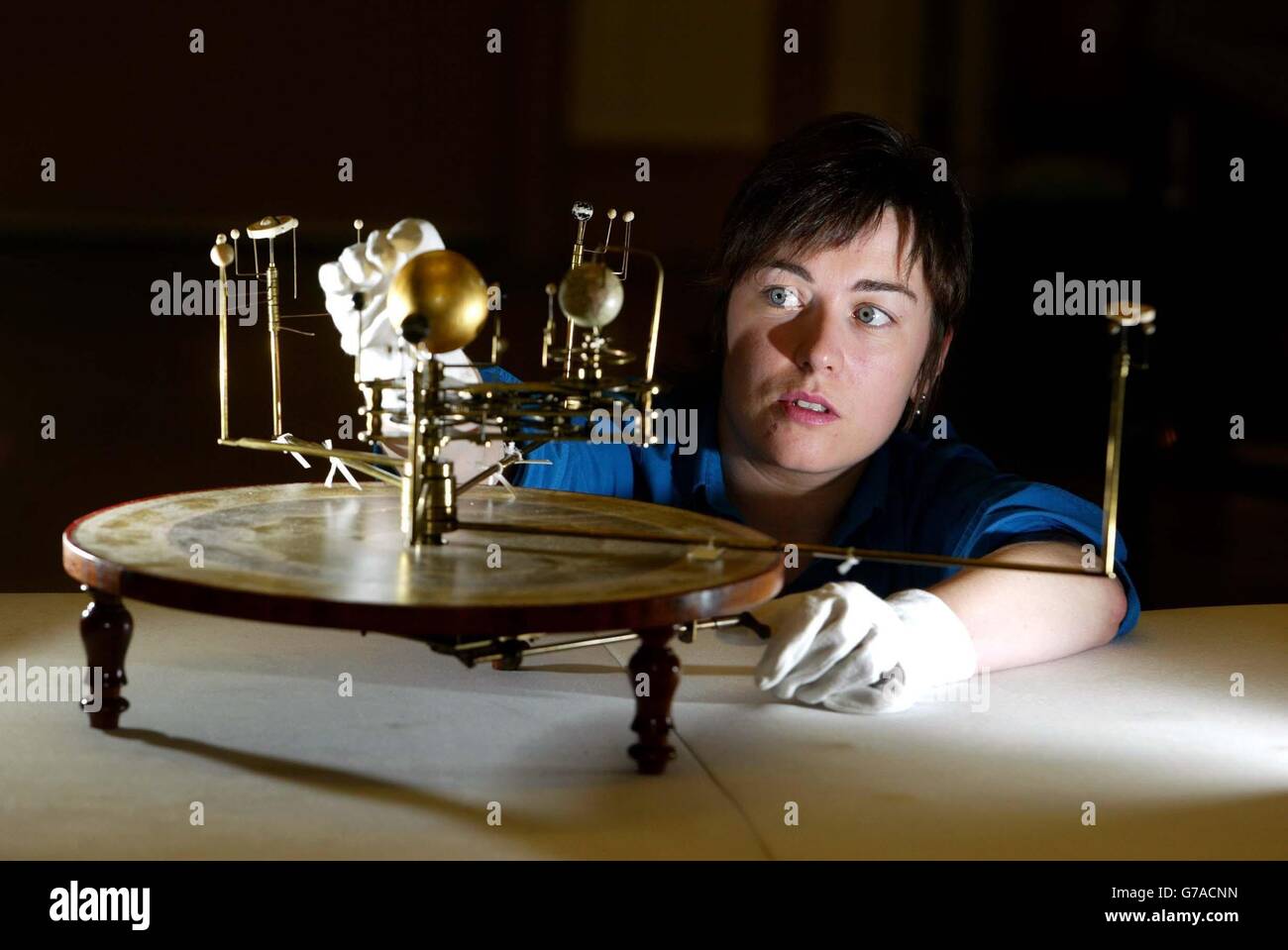 Astronomy Curator Alison Boyle uses an Orrery Scientific teaching aid ...