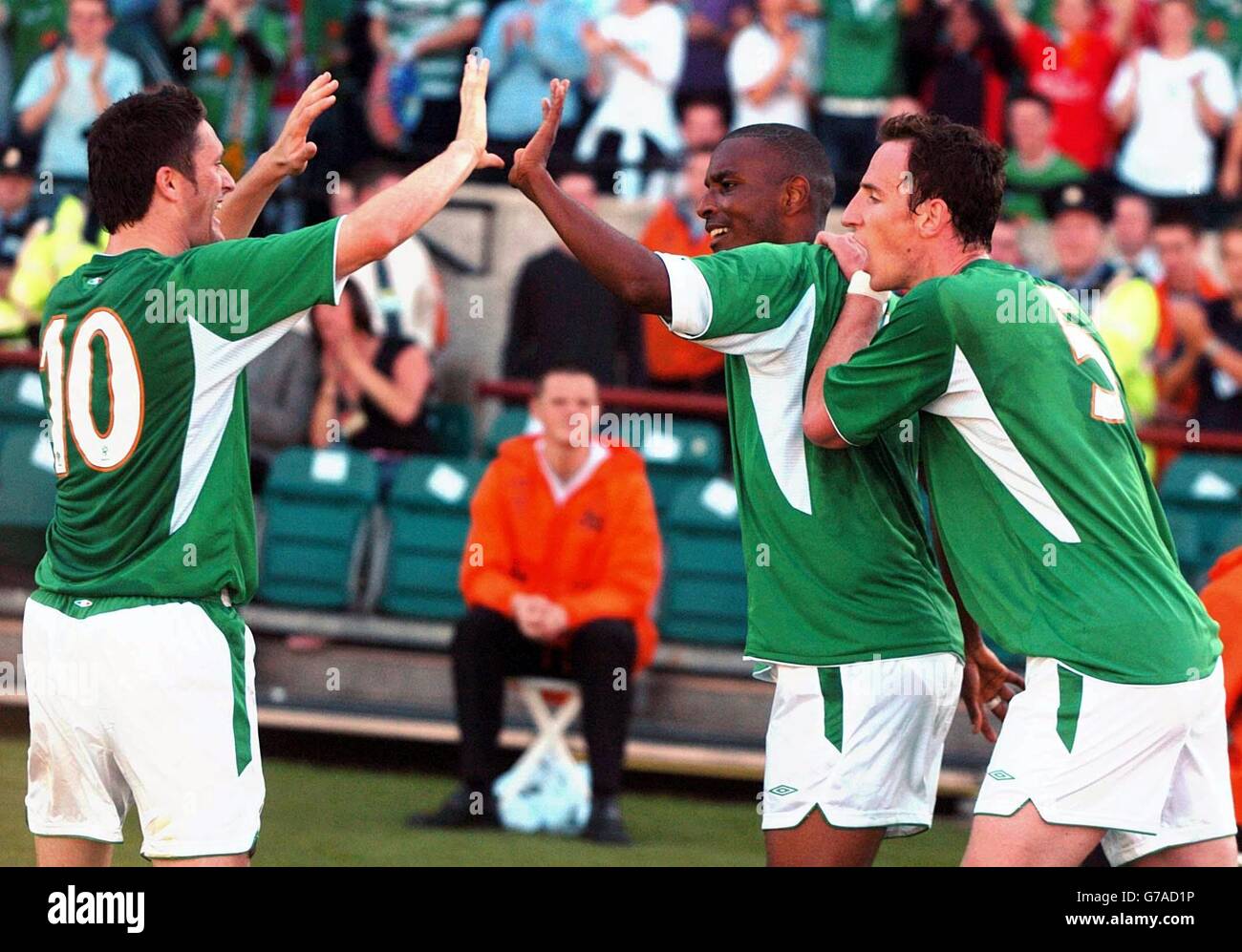 Clinton Morrison (c) is congratulated by Robbie Keane (l) and Andy O ...