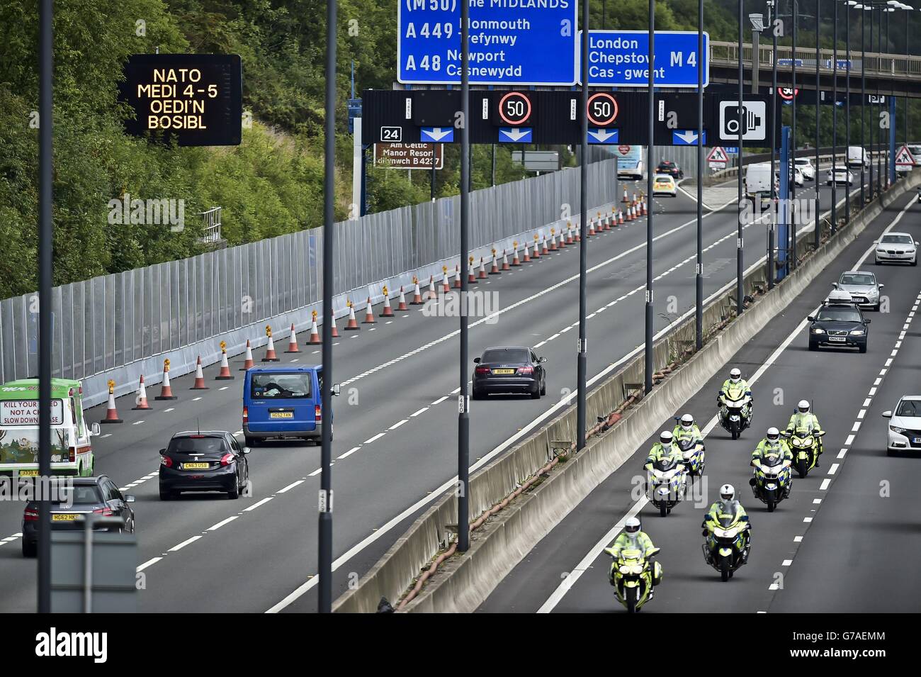 Police pass security fencing near Celtic Manor Resort near junction 24 ...