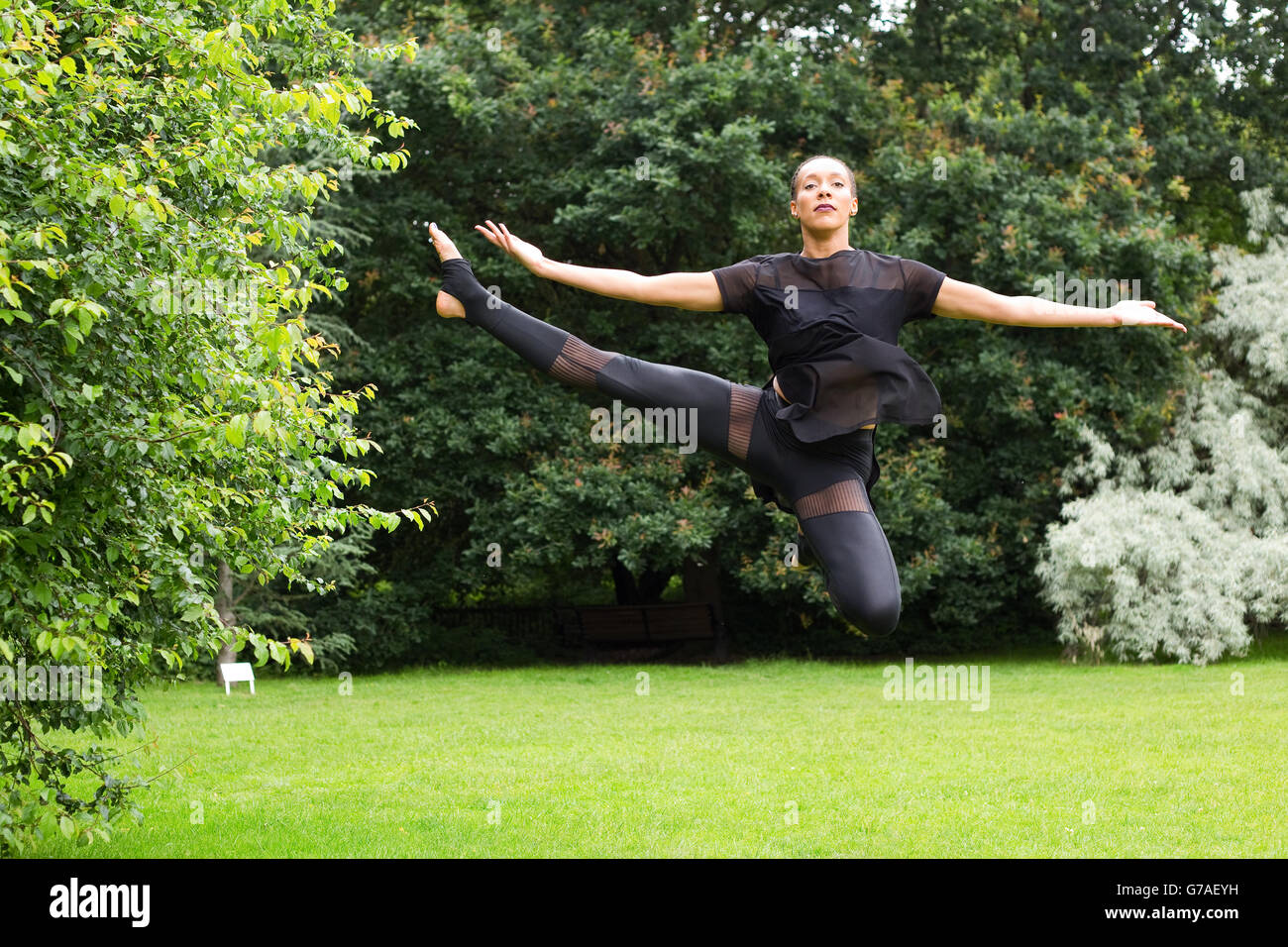 A jazz dancer performing a jump Stock Photo - Alamy