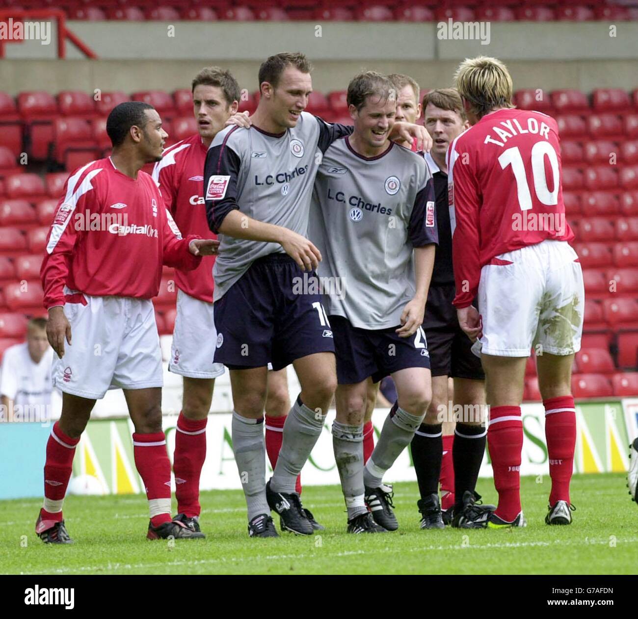 Nottingham Forest players protest as Mark Rivers (R) celebrates his ...