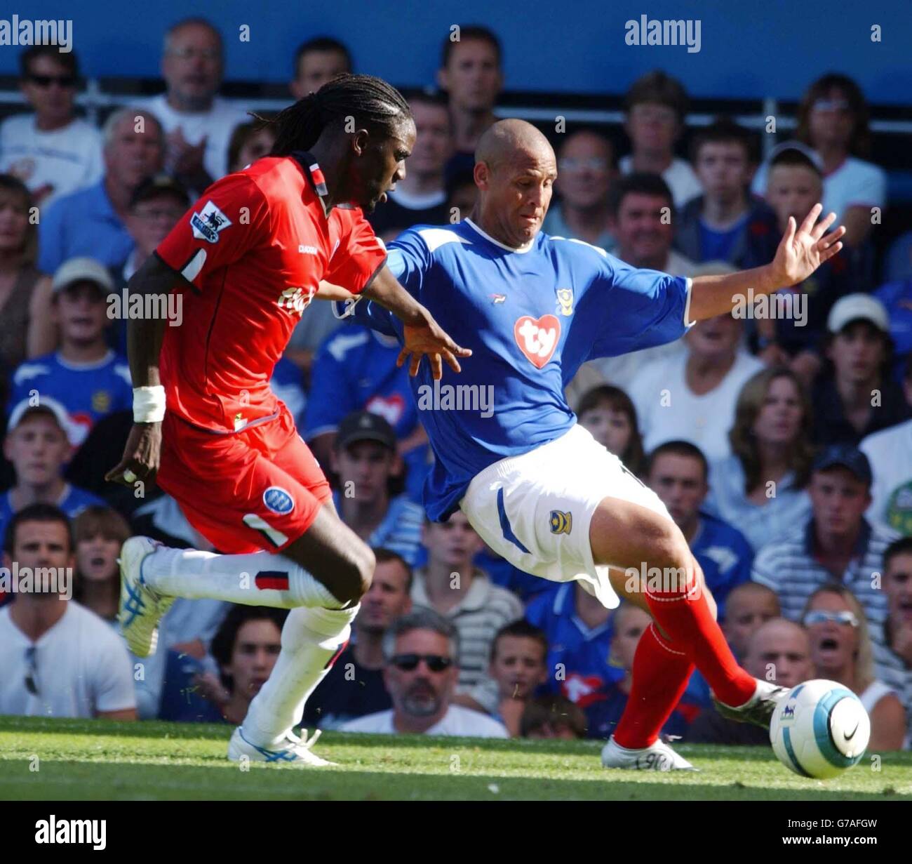Portsmouth's Nigel Quashie in action against Birmingham City's Mario ...
