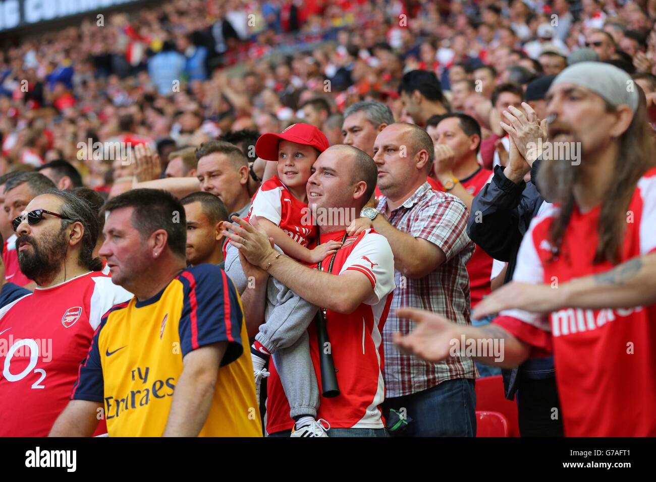 Arsenal fans show their support in the stands during the Community ...