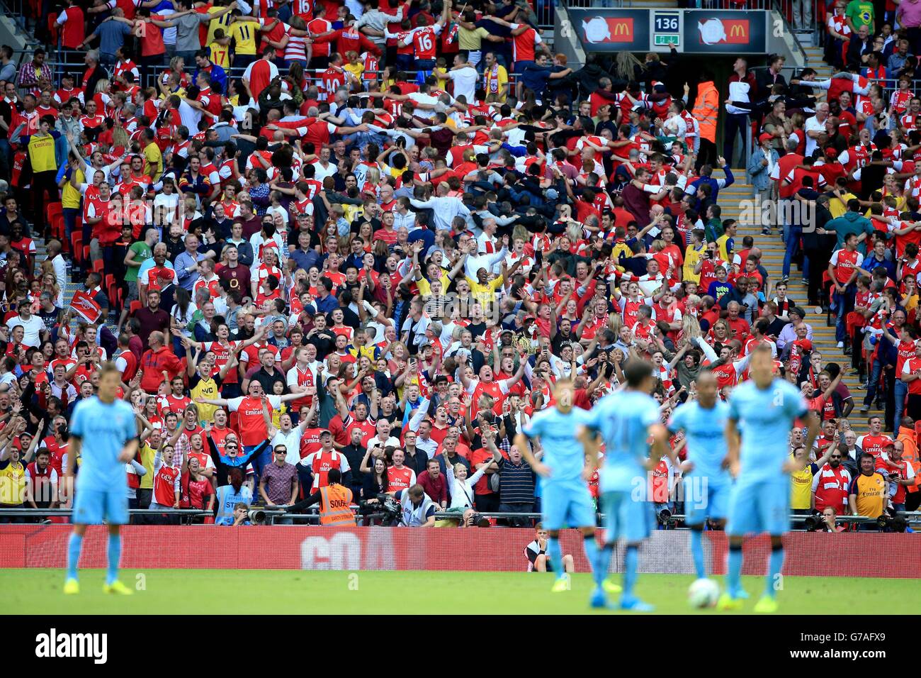 Manchester city fans do the poznan celebration in the stands hi-res ...