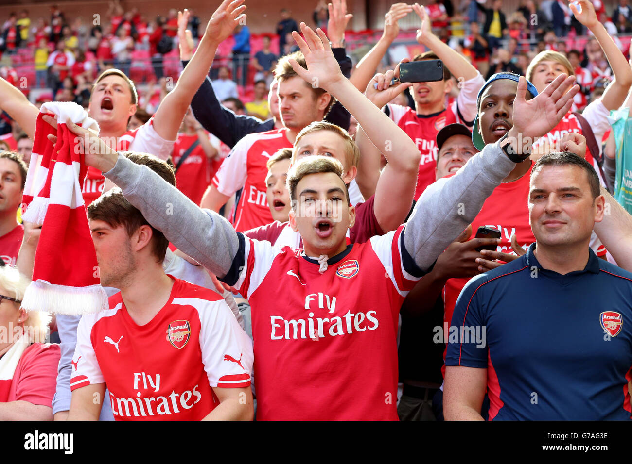Arsenal fans celebrate in the stands hi-res stock photography and ...