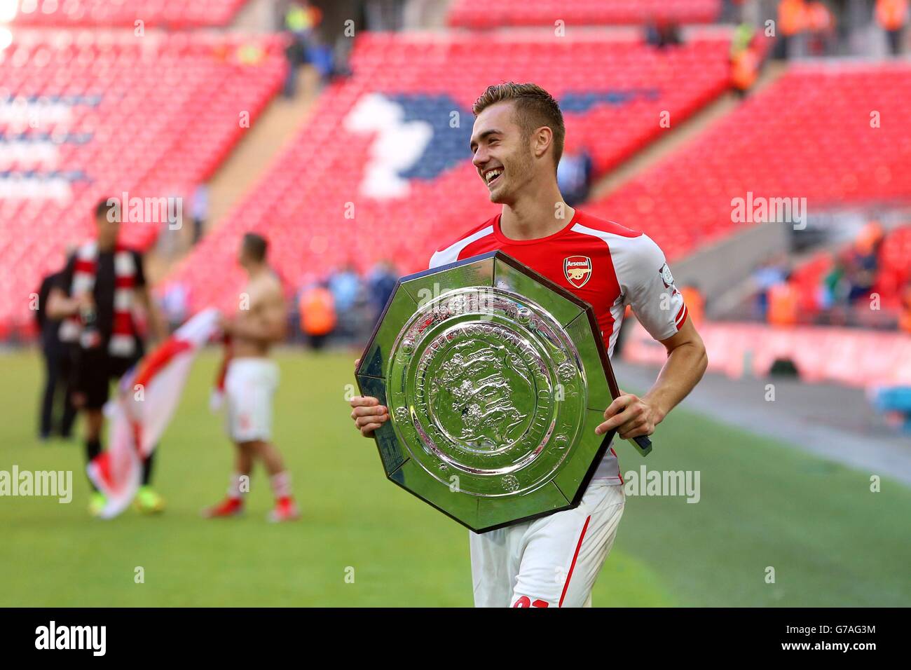Football celebrating trophy shield hi-res stock photography and images ...