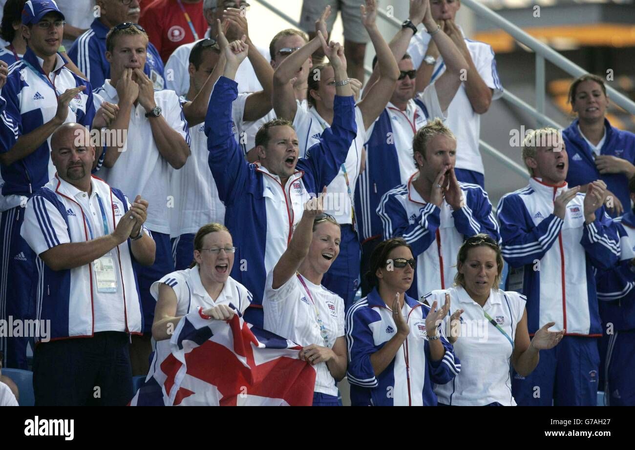 Members of Britain's Olympic team cheer as British swimmer Stephen ...