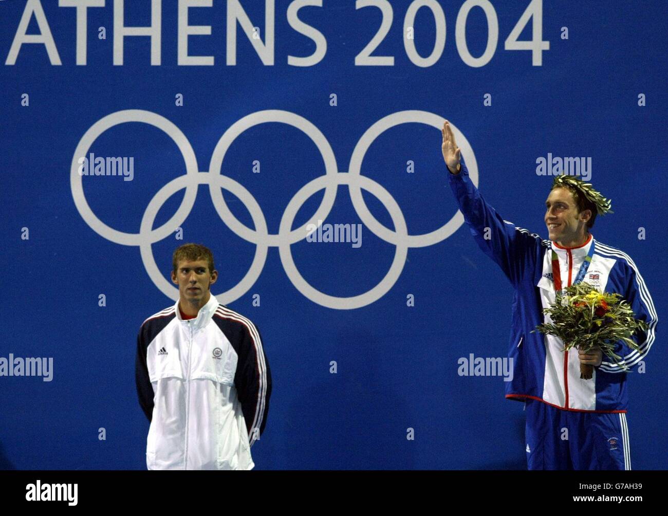 American Gold Medallist Michael Phelps (left) watches as British ...