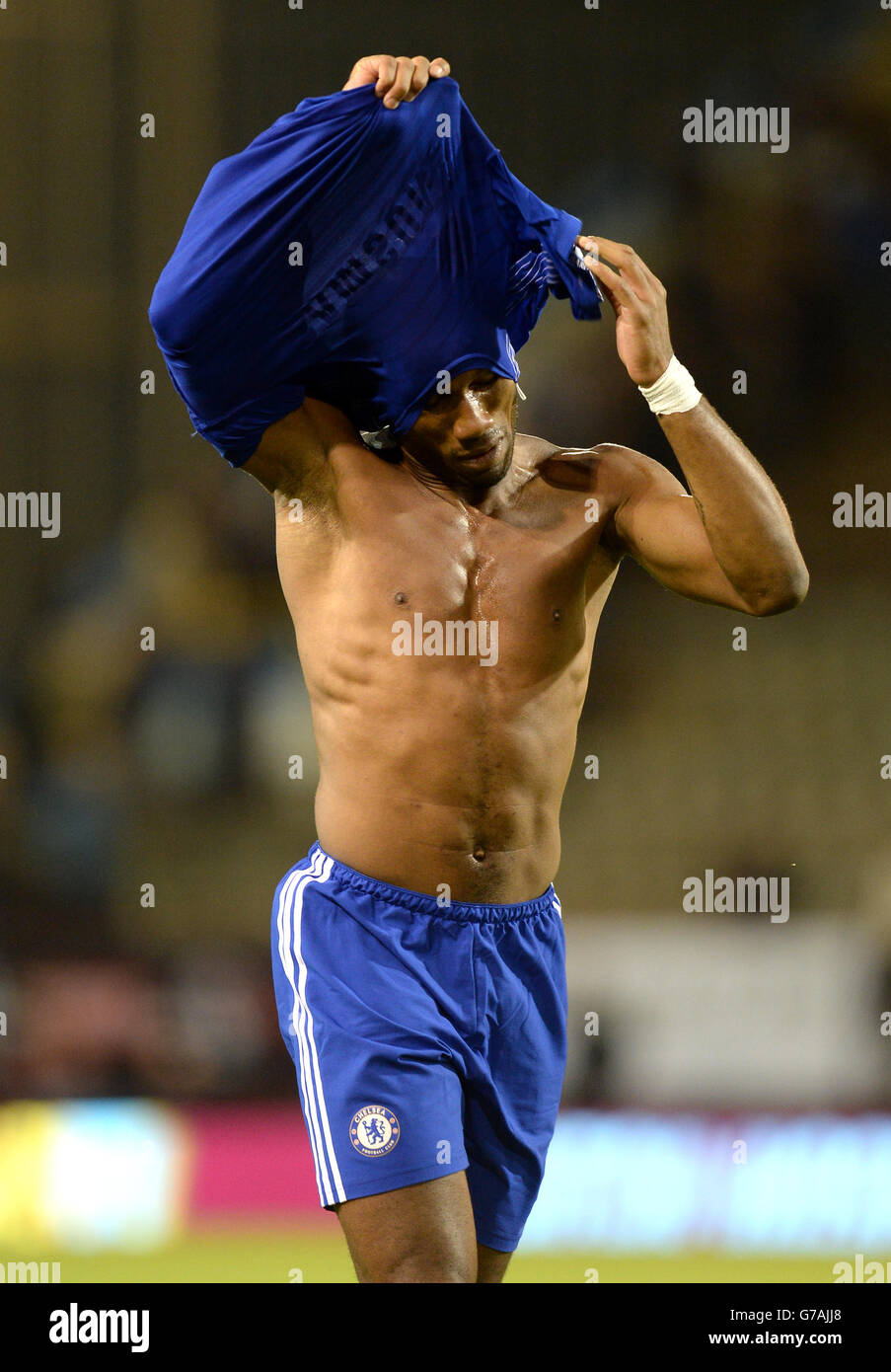 Chelsea's Didier Drogba takes off his shirt after the final whistle ...