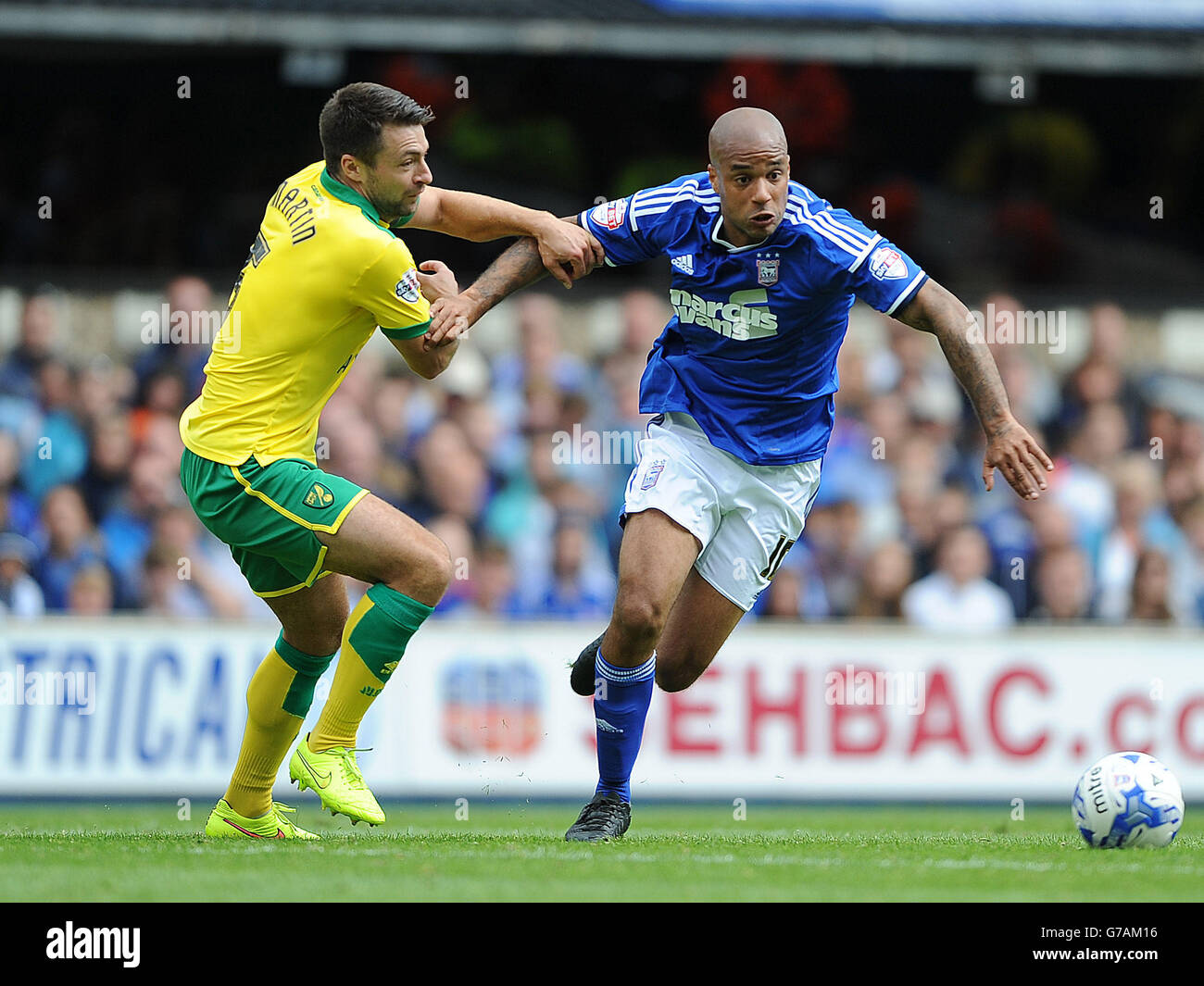 Ipswich Town's David McGoldrick (right) and Norwich City's Russell ...