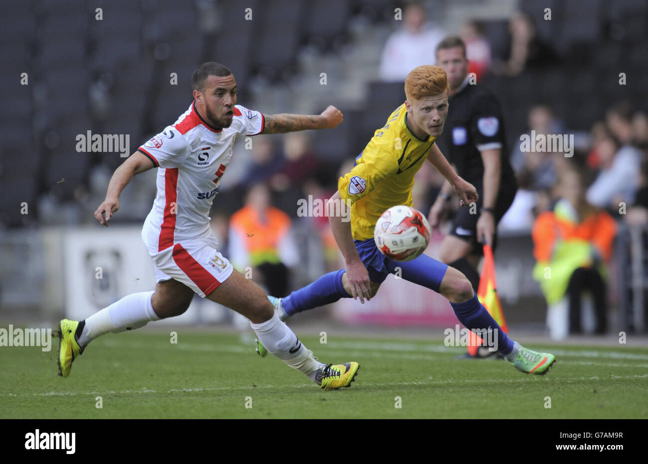 Coventry City's Ryan Haynes (right) is challenged by MK Dons' Samir ...