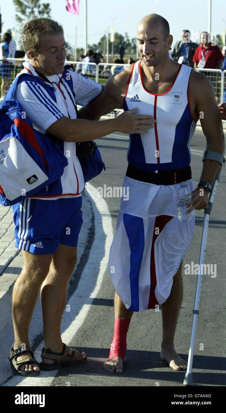 Great Britain's Ian Wynne from Tonbridge (right) is helped by an ...
