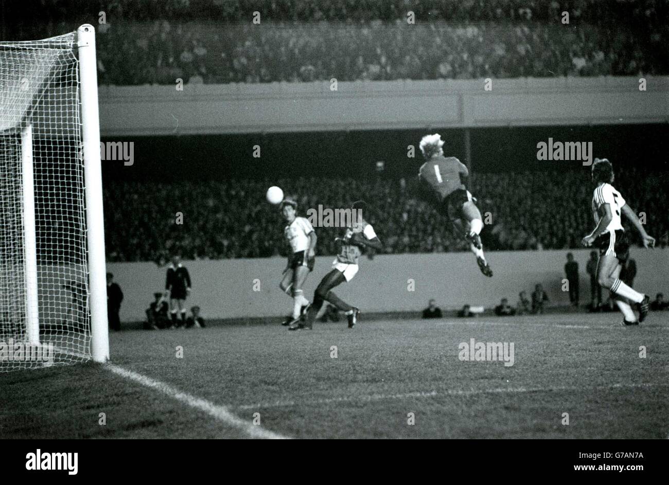 Manchester United goalkeeper Gary Bailey clears from Arsenal's Brian ...