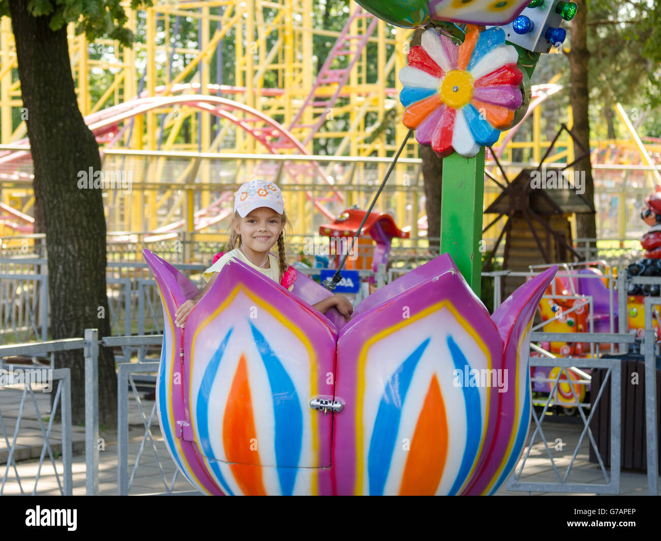 Cheerful girl on carousel hi-res stock photography and images - Alamy