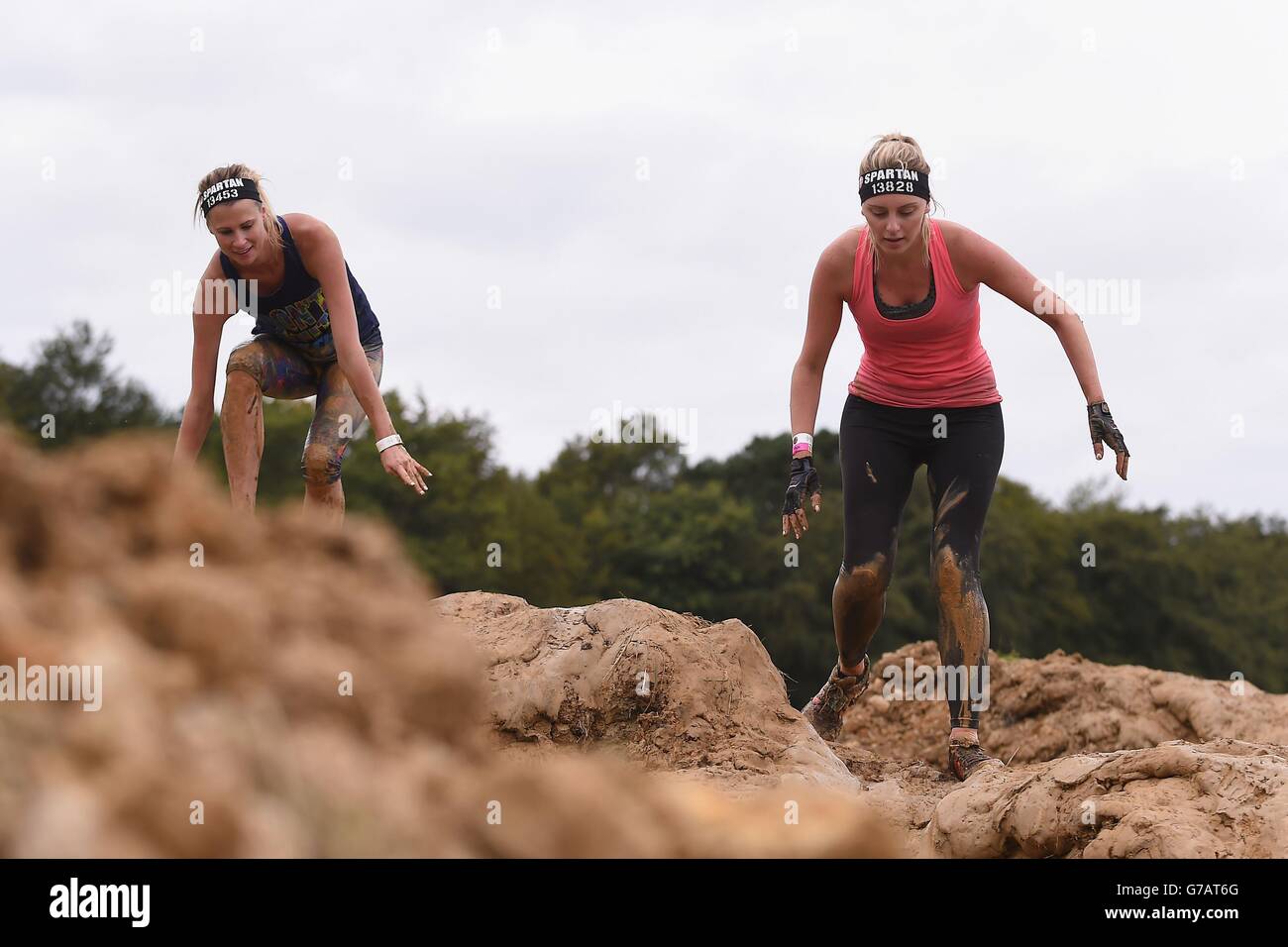 Competitors take part in the Spartan Sprint event at Pippingford Park ...