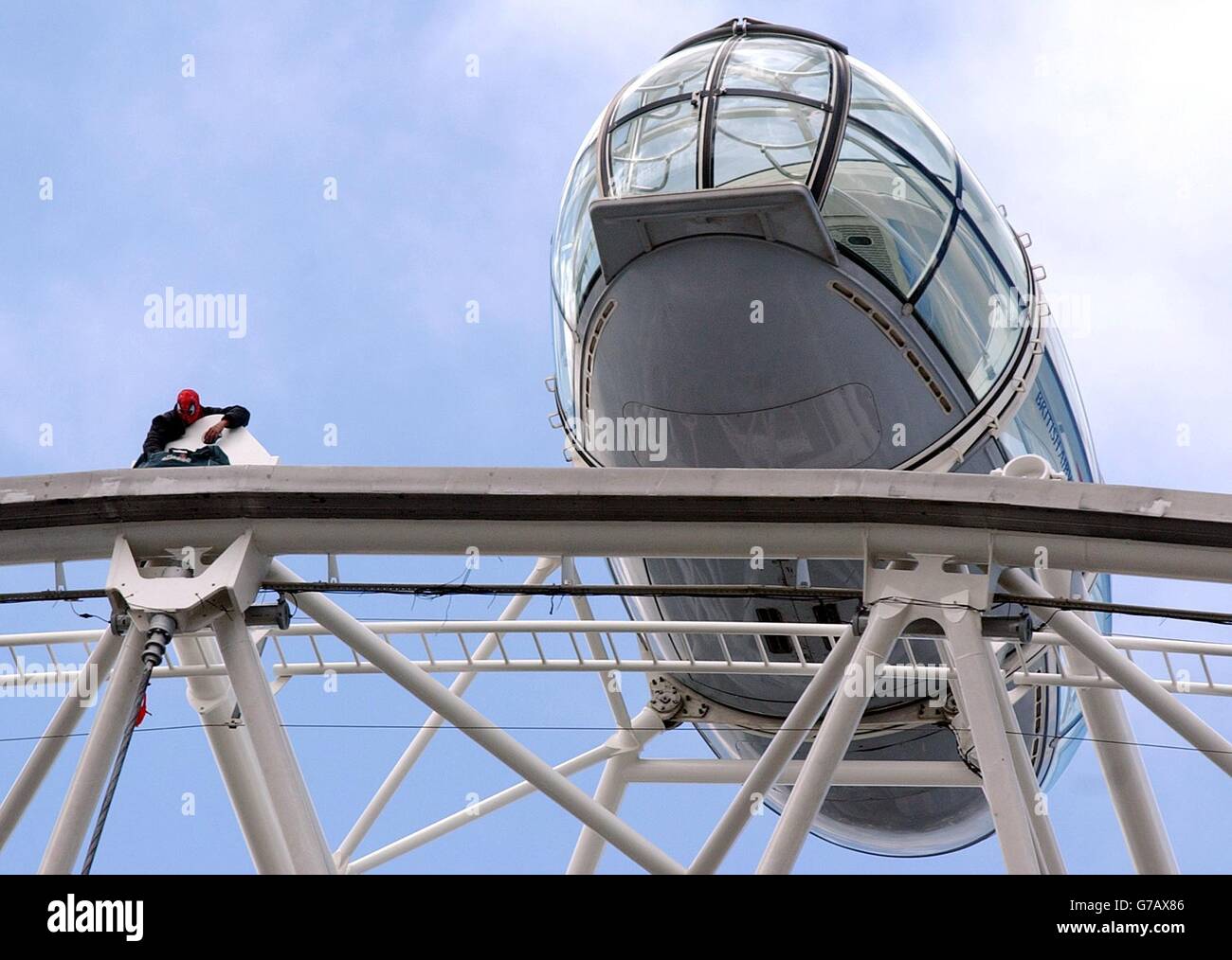 Protester David Chick, 37, in a Spiderman outfit 450 feet up on the top ...