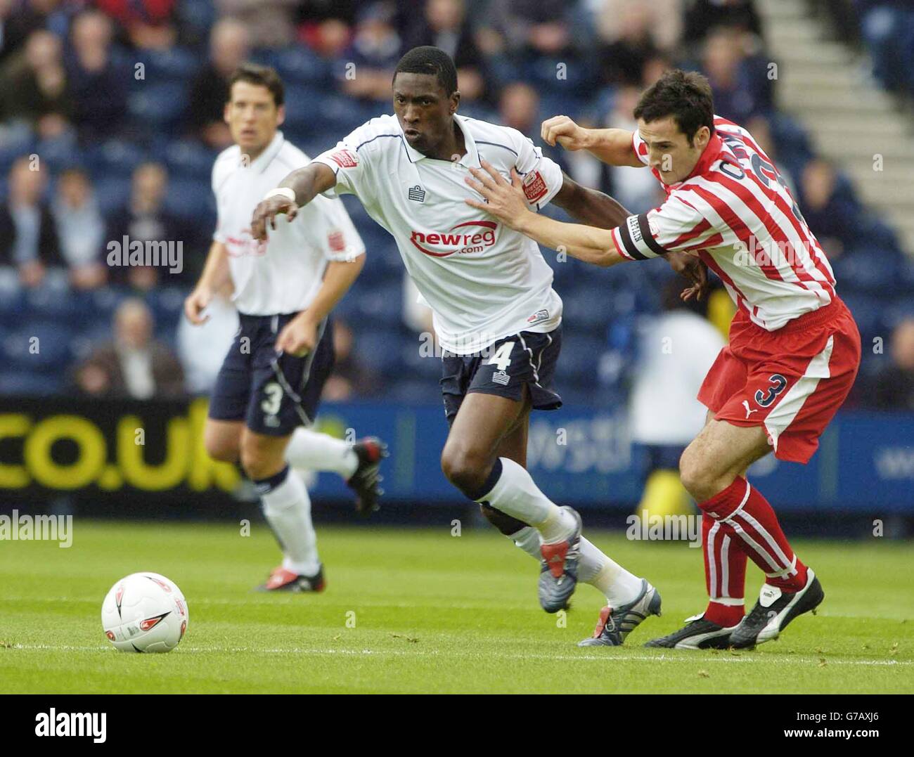 Preston North End's Dickson Etuhu (left) evades Stoke City's Clive ...