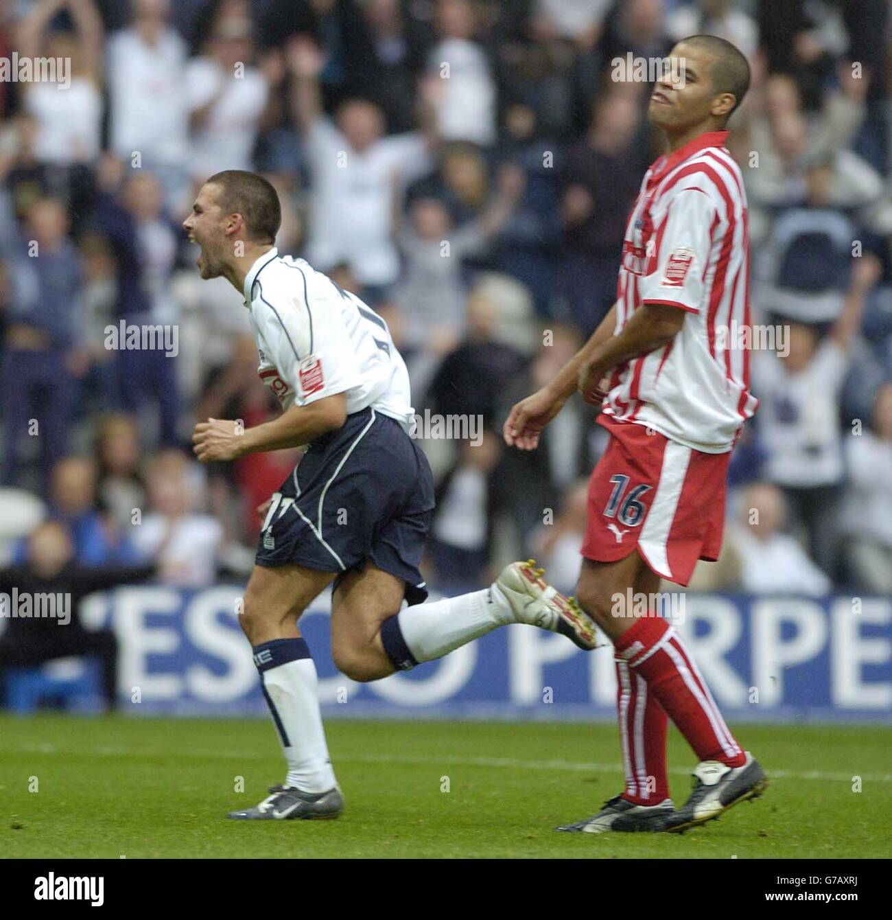 Preston North End's striker David Healey wheels away in celebration ...