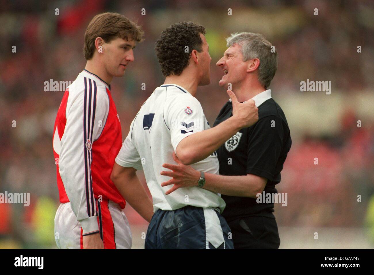 ARSENAL'S TONY ADAMS WITH PAUL STEWART AND REFEREE R.S. LEWIS. ARSENAL ...