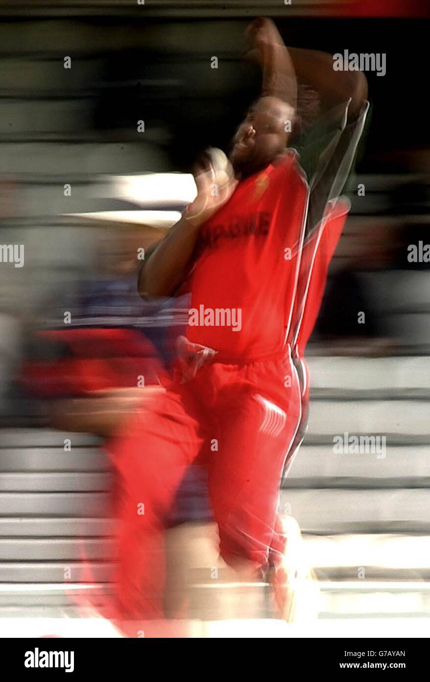 . NO MOBILE PHONE USE. Zimbabwe pace bowler Douglas Hondo sends down a ...