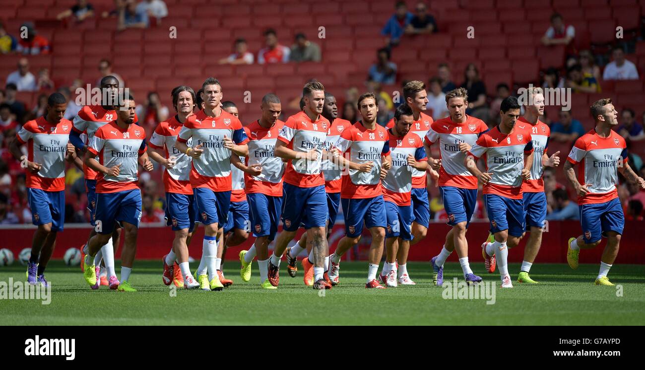 The Arsenal players warm up during the training session at the Emirates ...