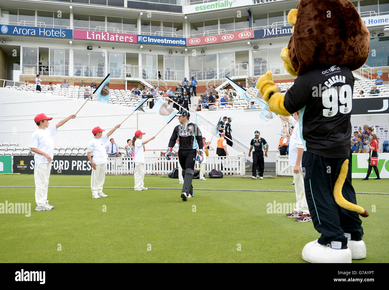 Surrey's players walk through the guard of honour before the game Stock ...