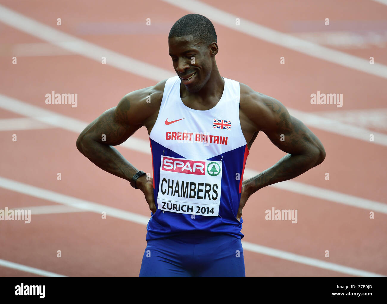 Great Britain's Dwain Chambers smiles after winning his heat of the Men ...