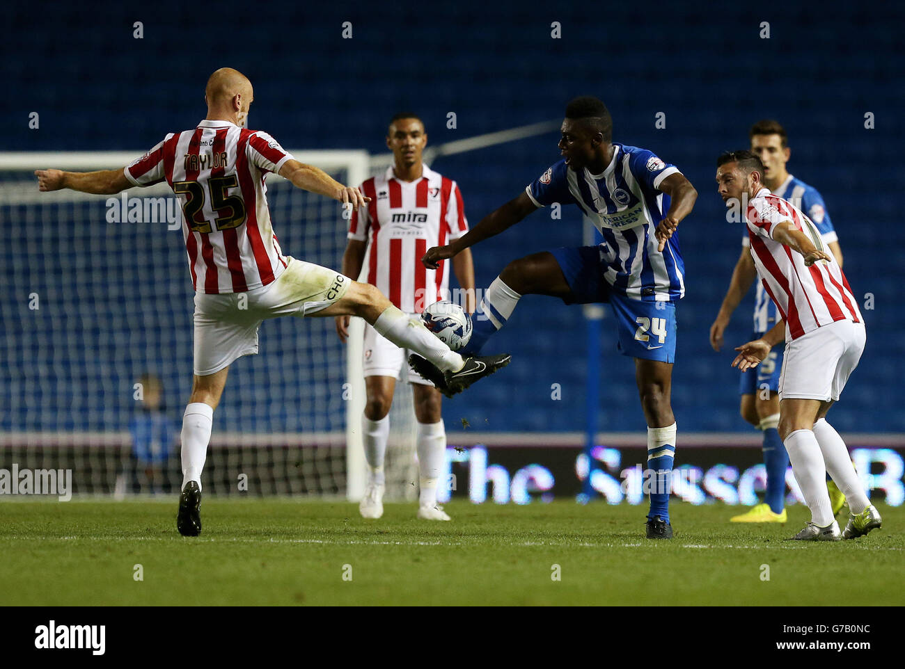 Brighton's Rohan Ince (right) is challenged by Cheltenham Town's Jason ...