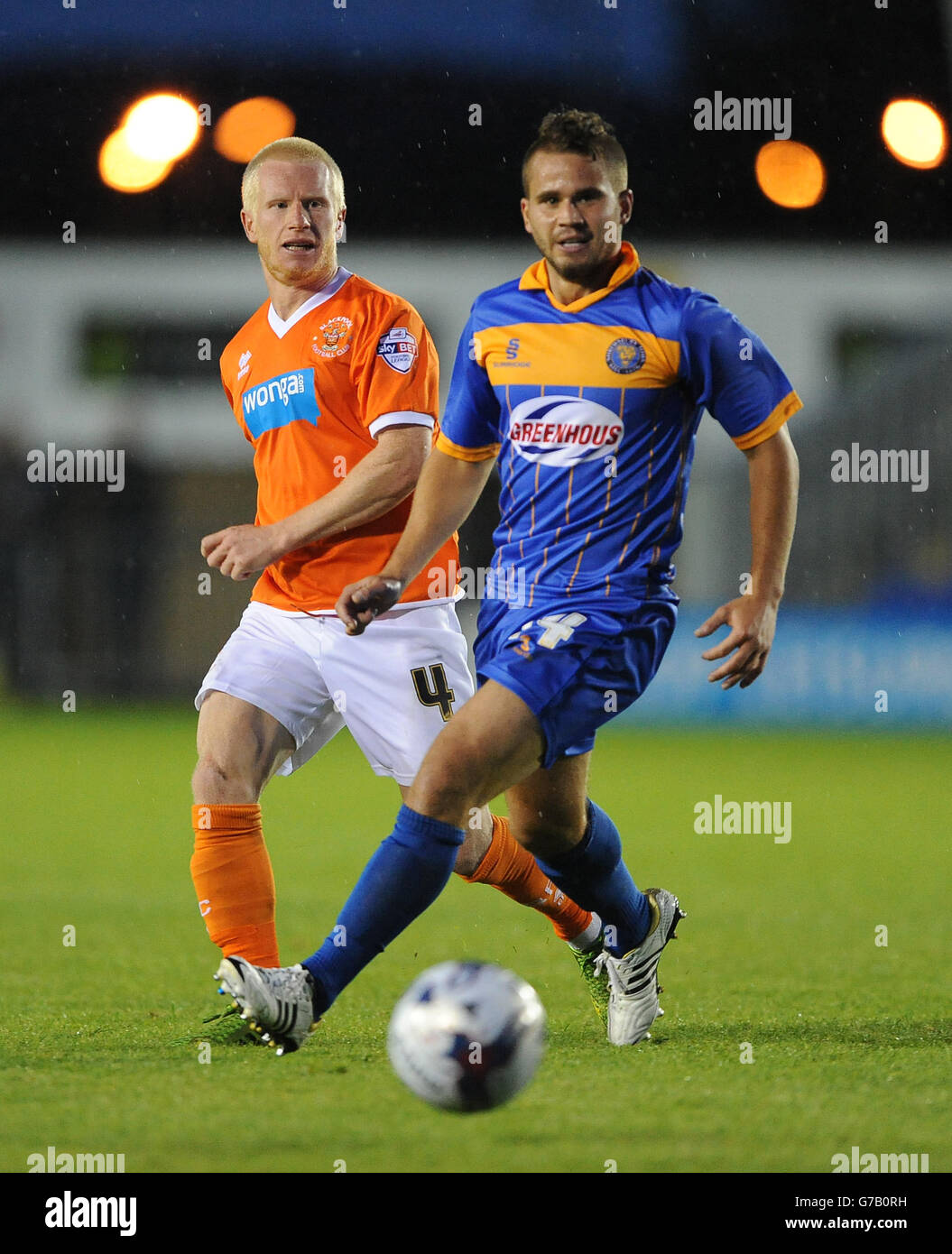 Shrewsbury Town's James Wesolowski (right) and Blackpool's David ...