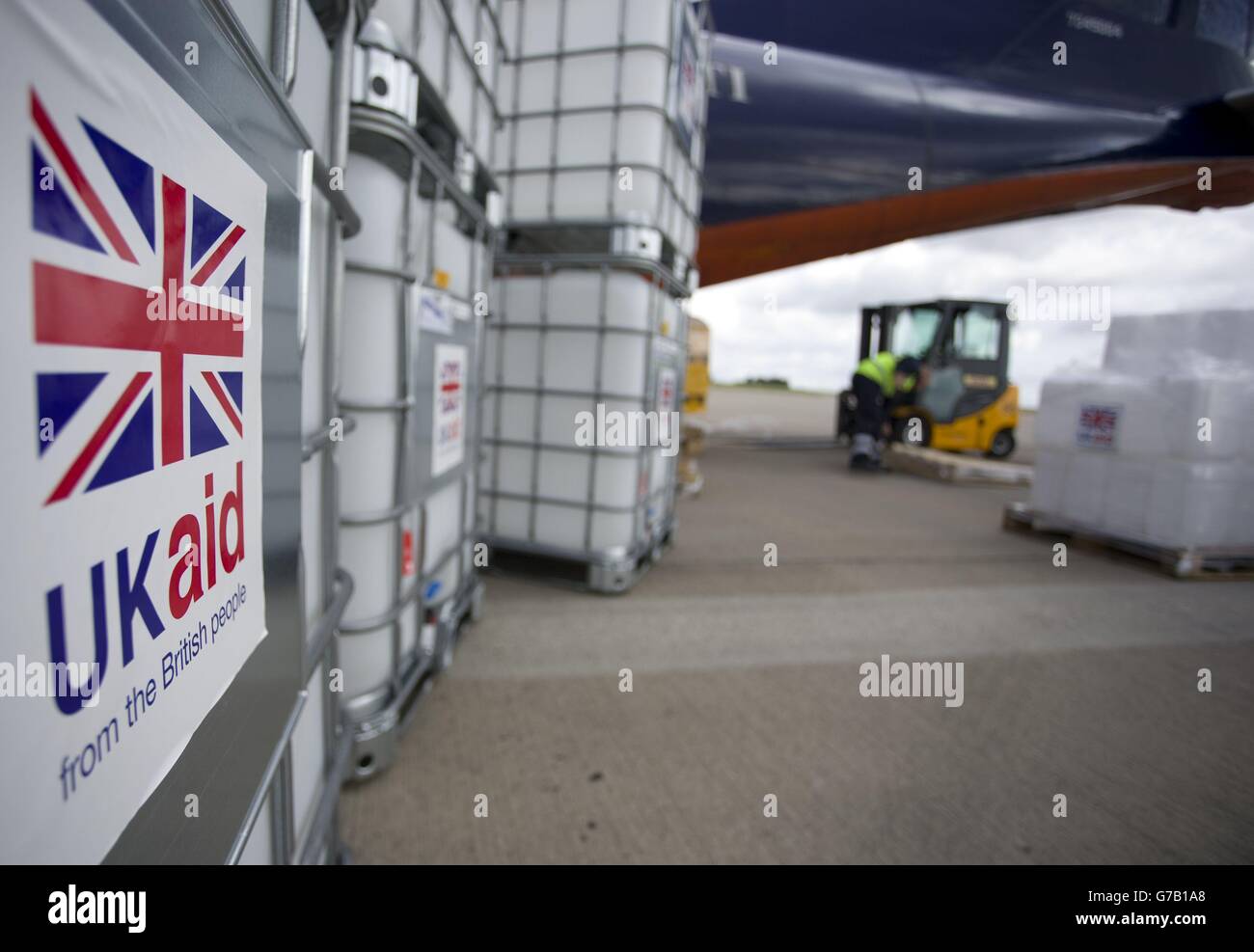 Cargo from UK Aid is loaded on to an Antonov An-12B aircraft at East ...