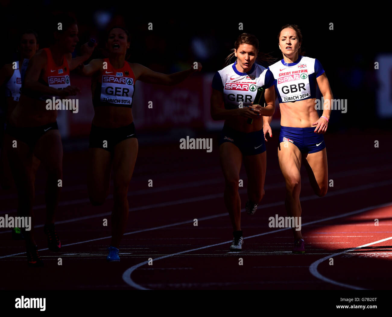 Great Britain's Emily Diamond (right) hands over to Kelly Massey in the ...