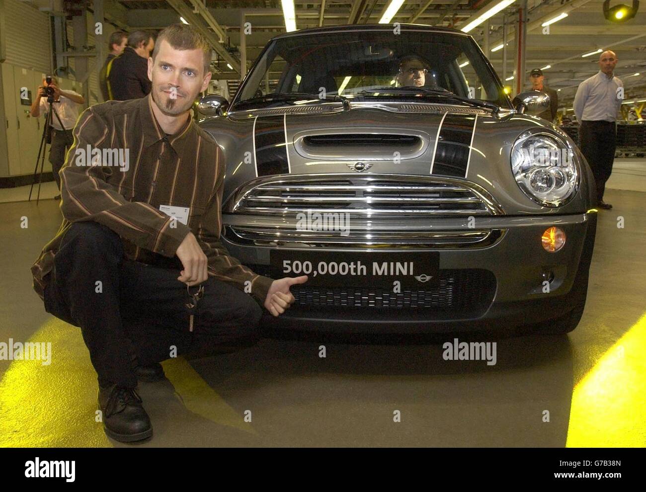 California poses proudly in his new mini cooper hi-res stock ...