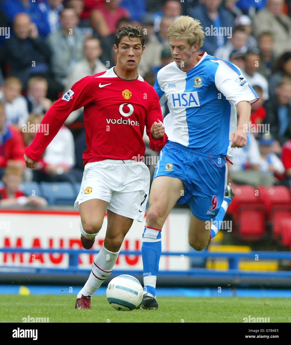 Manchester United's Cristiano Ronaldo (R) is challenged by Blackburn ...
