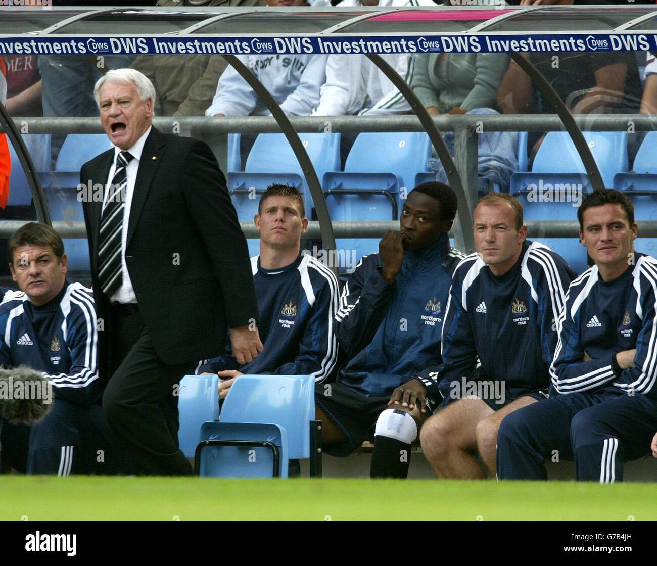 Football players sitting on bench hi-res stock photography and images ...