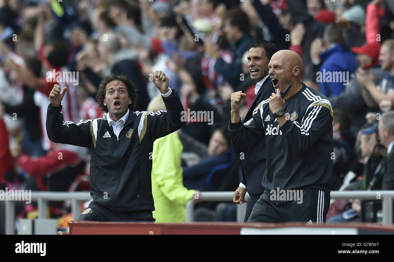 Sunderland's manager Gus Poyet and his backroom staff celebrate the ...