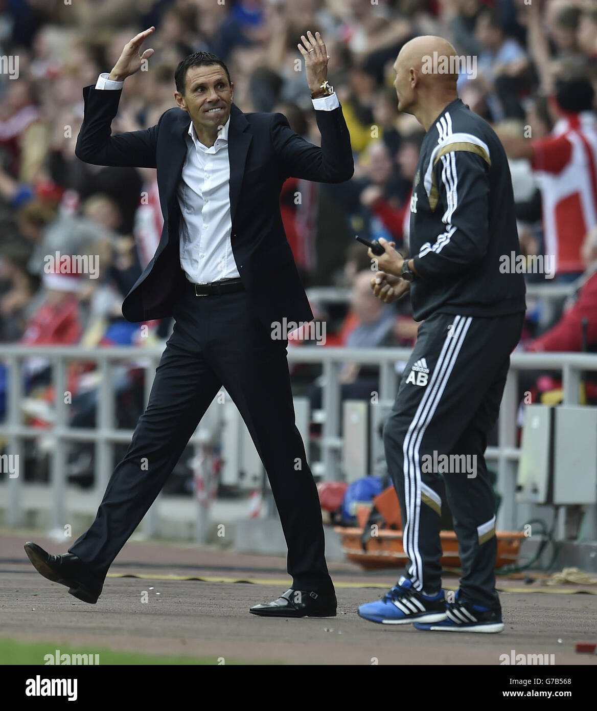 Sunderland's manager Gus Poyet and his backroom staff celebrate the ...