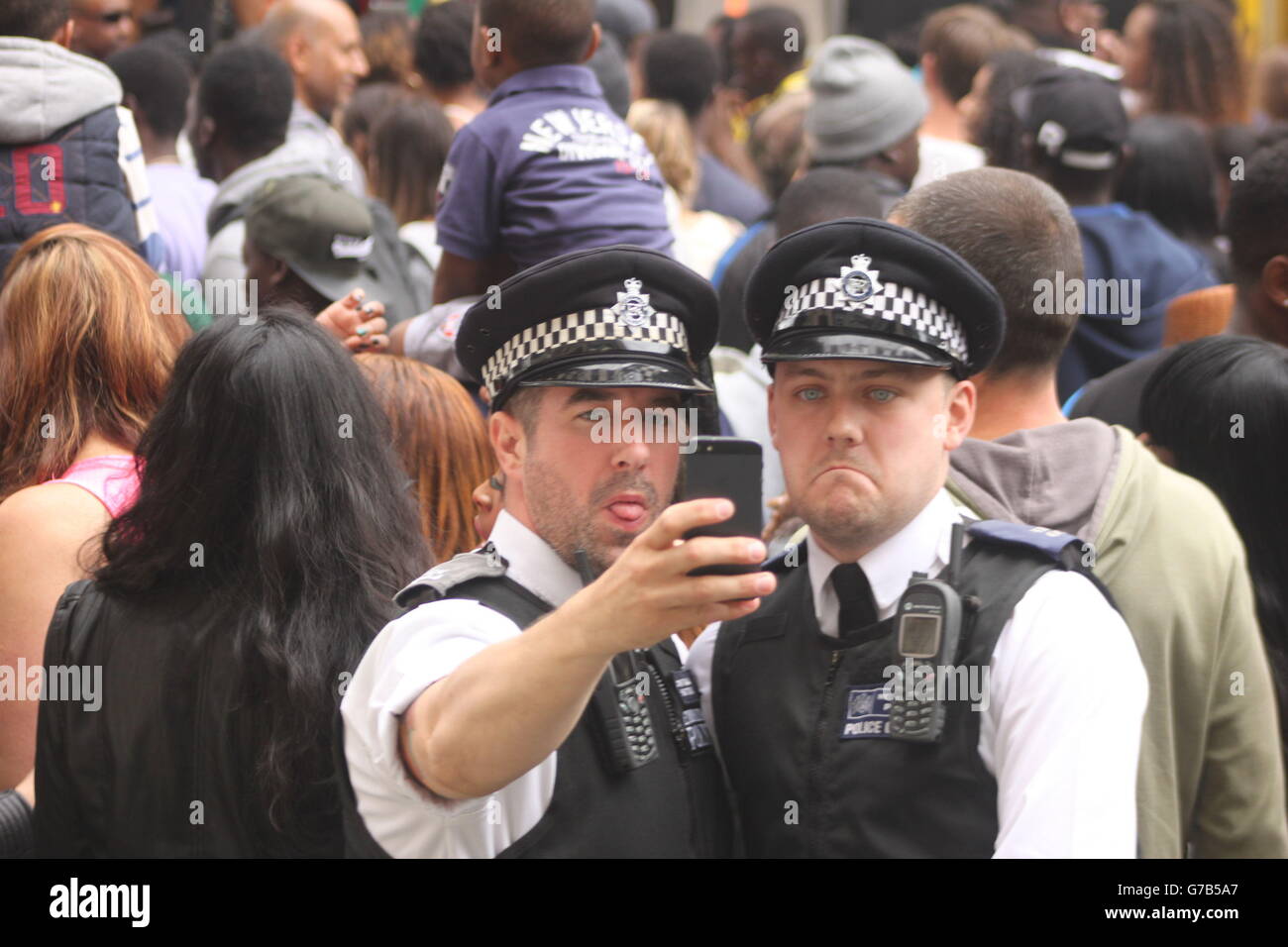 Police officers take a selfie during the Notting Hill Carnival family ...