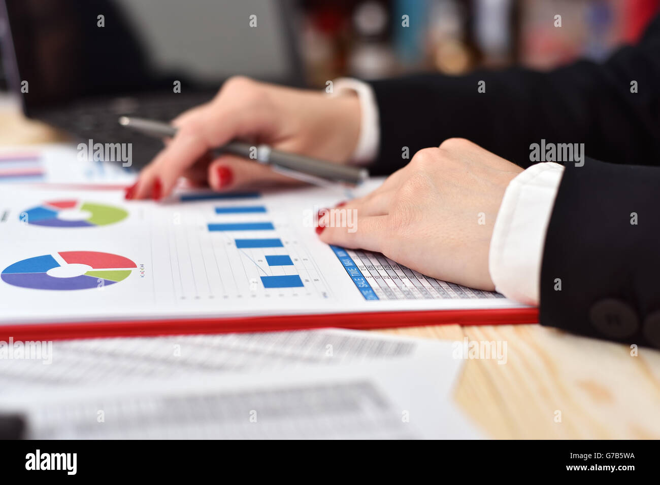 hand checks the start up report. business concept Stock Photo - Alamy