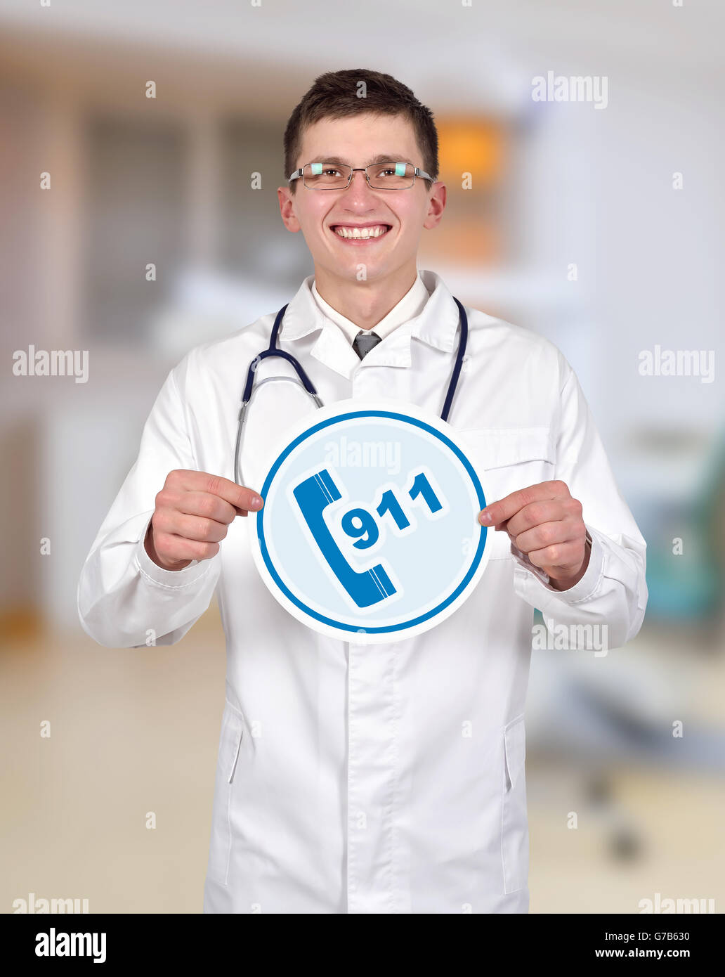 doctor holding 911 symbol on a clinic background Stock Photo - Alamy